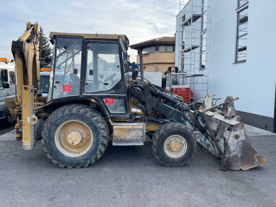 CAT 438 C Kombinirka 4x4x4