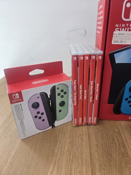 Nintendo Switch OLED + Igrice