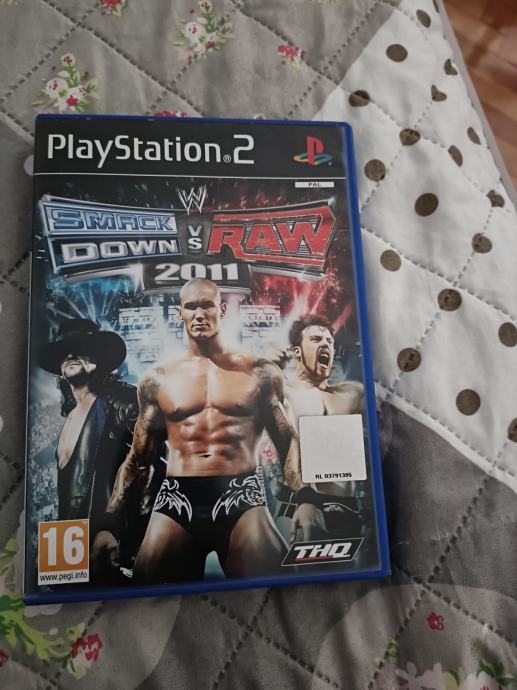 PS2 smackdown vs raw 2011 original sa knjizicom