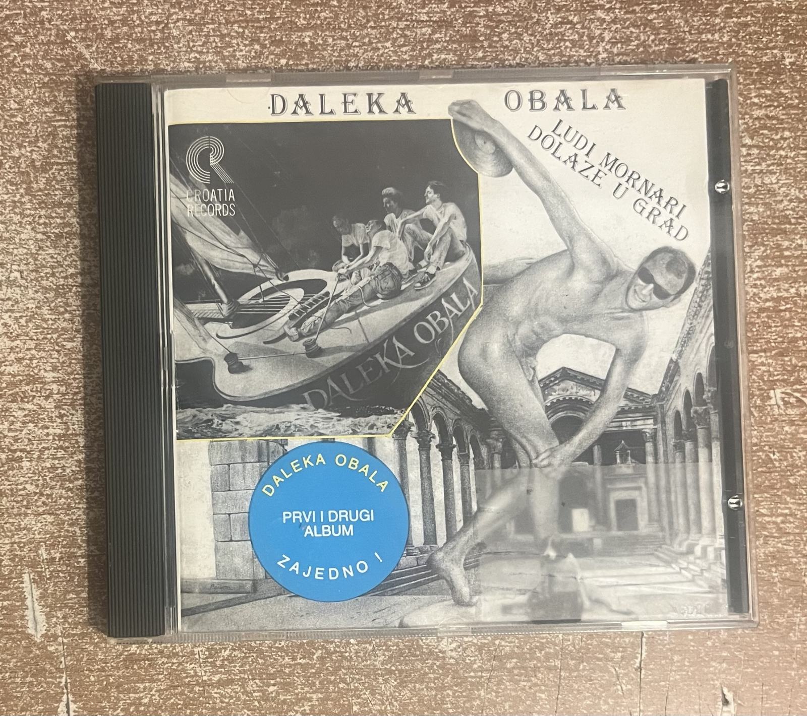 CD, DALEKA OBALA - LUDI MORNARI DOLAZE U GRAD