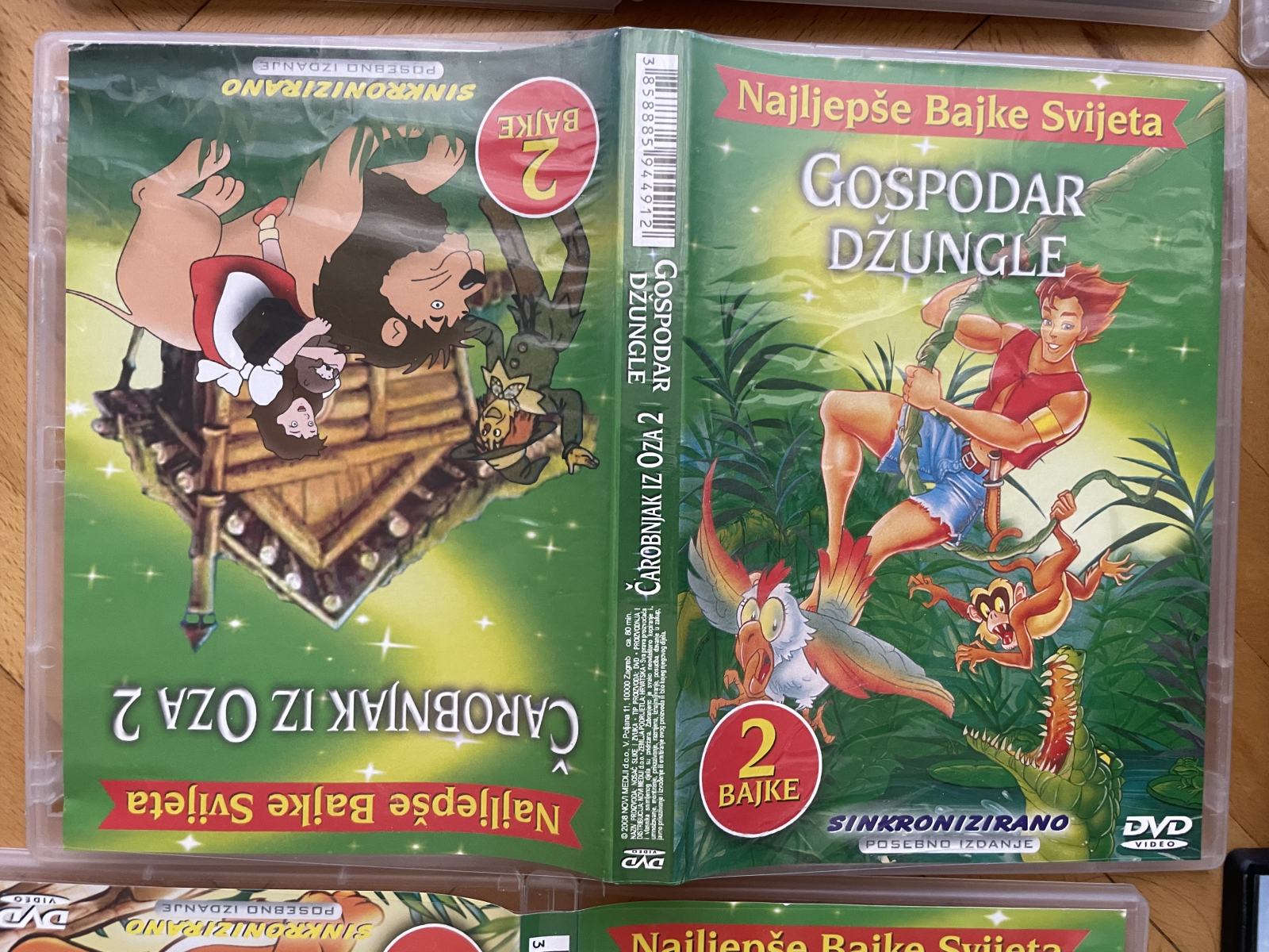 DVD s 2 animirana filma Gospodar džungle + Čarobnjak iz Oza 2
