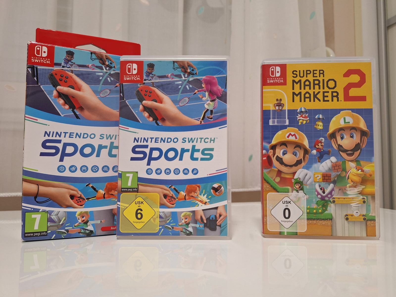 Super Mario Maker 2 i Nintendo Switch Sports + stalak za igre