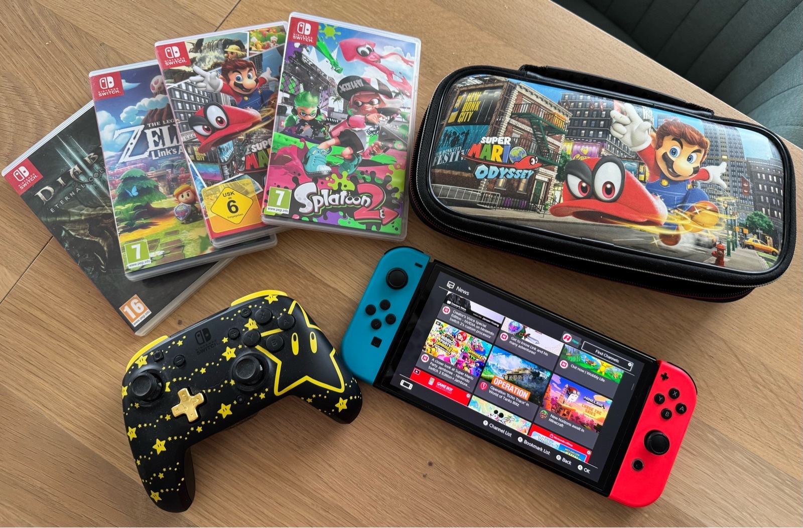 Nintendo Switch OLED, 4 igrice, dodatni kontroler i torbica