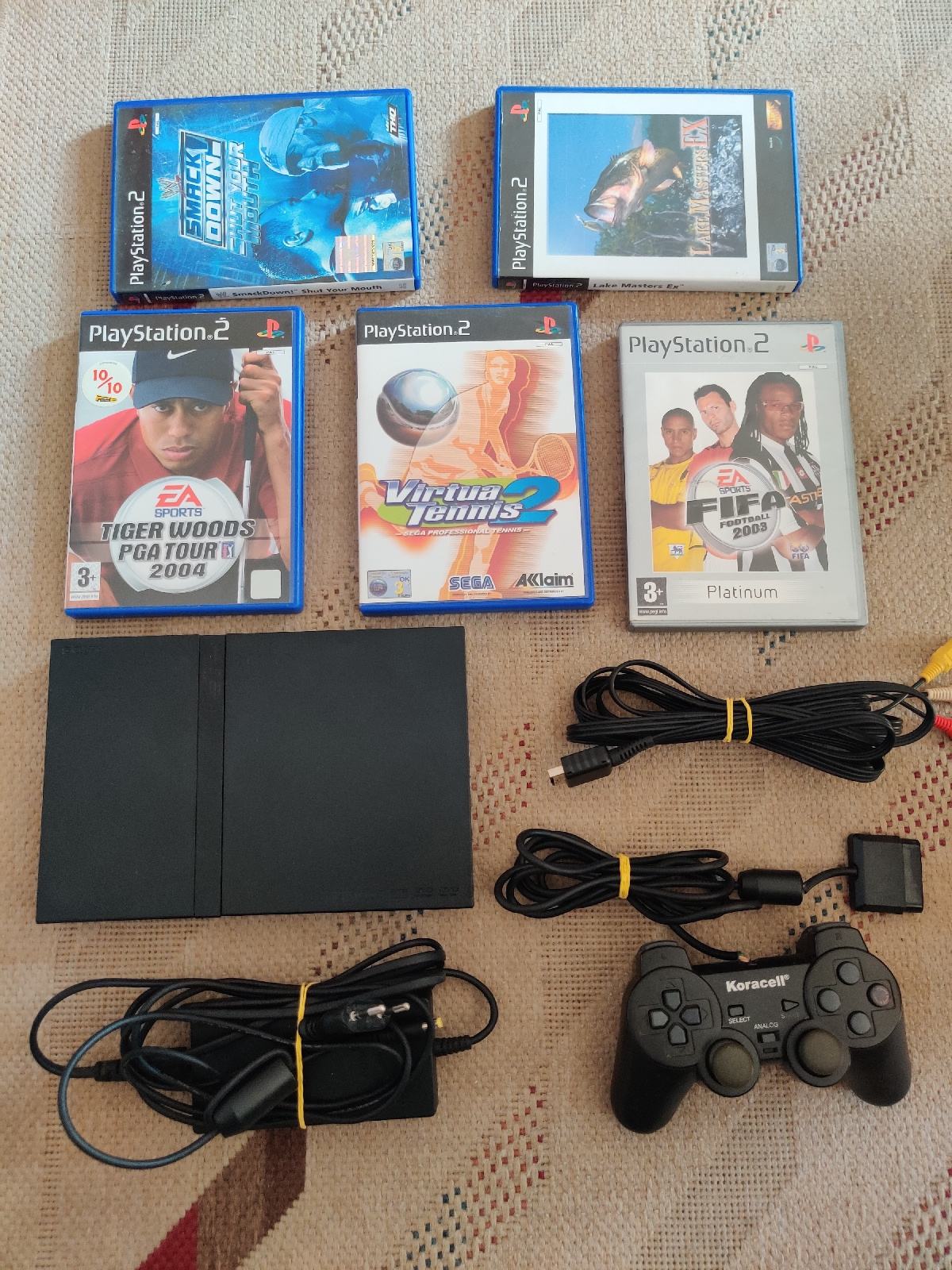 Playstation 2 + 5 original igara